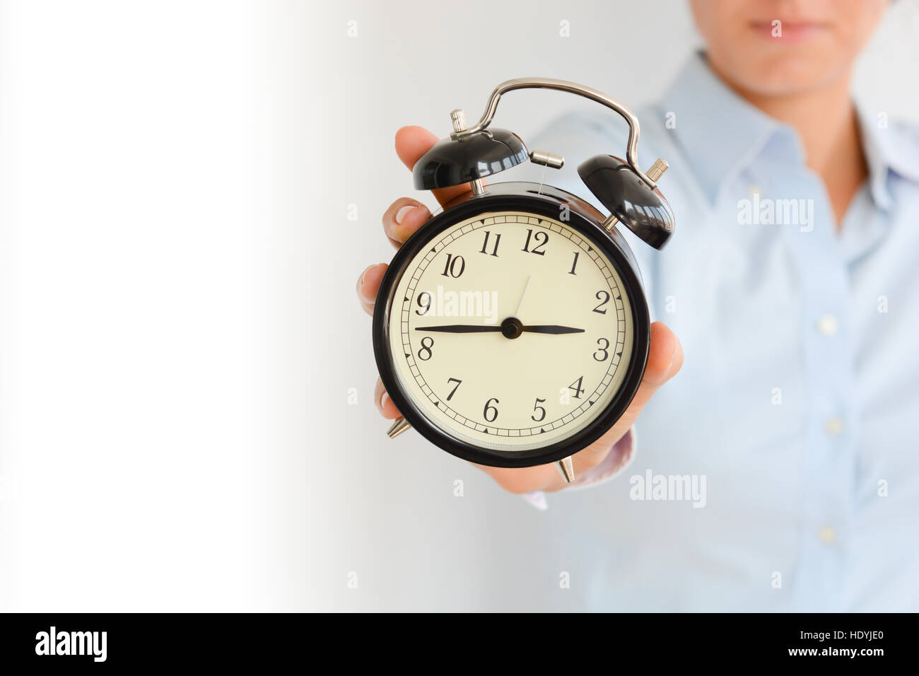 Hands holding clock hi-res stock photography and images - Alamy