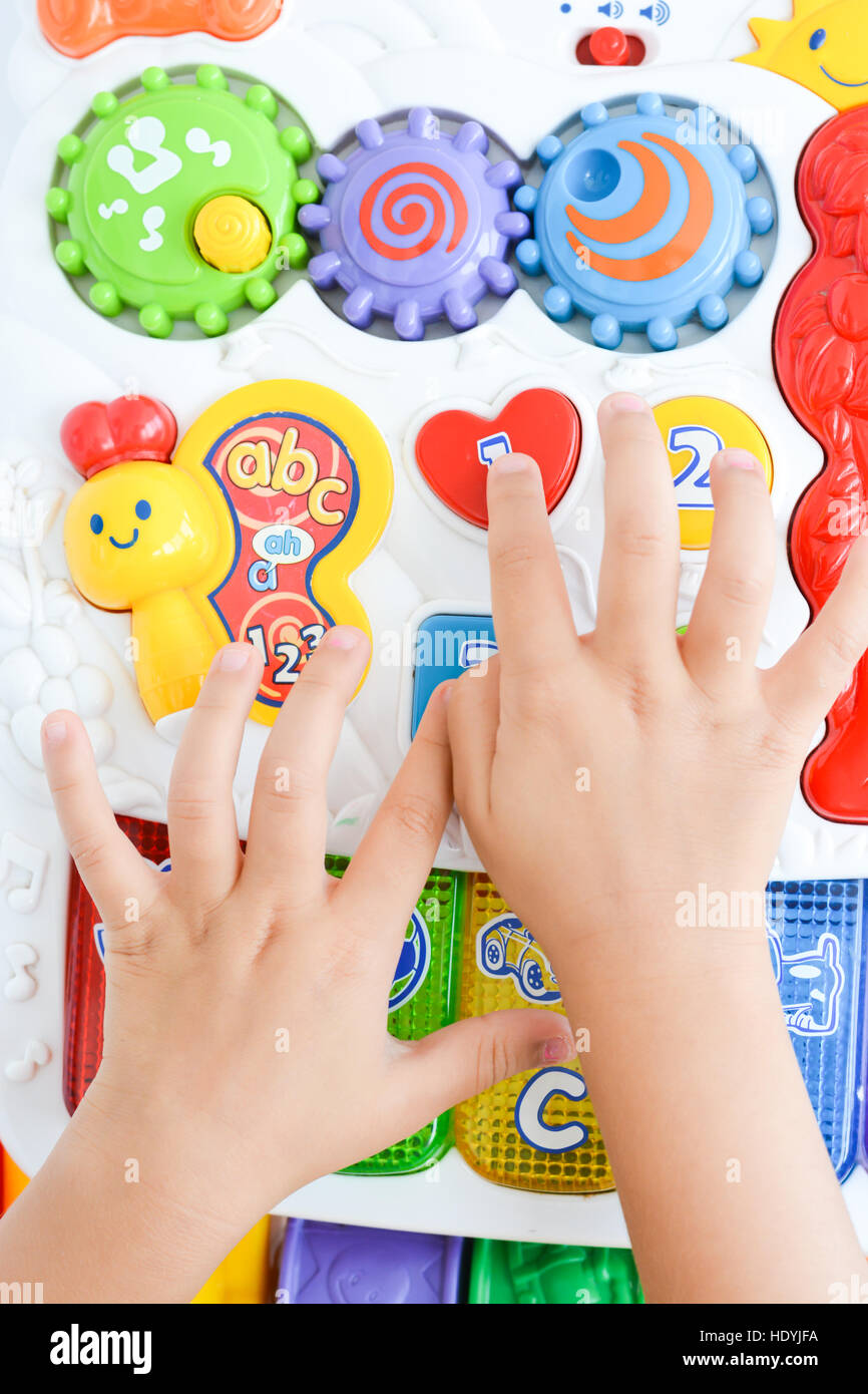 Child hands playing with educational toy Stock Photo - Alamy