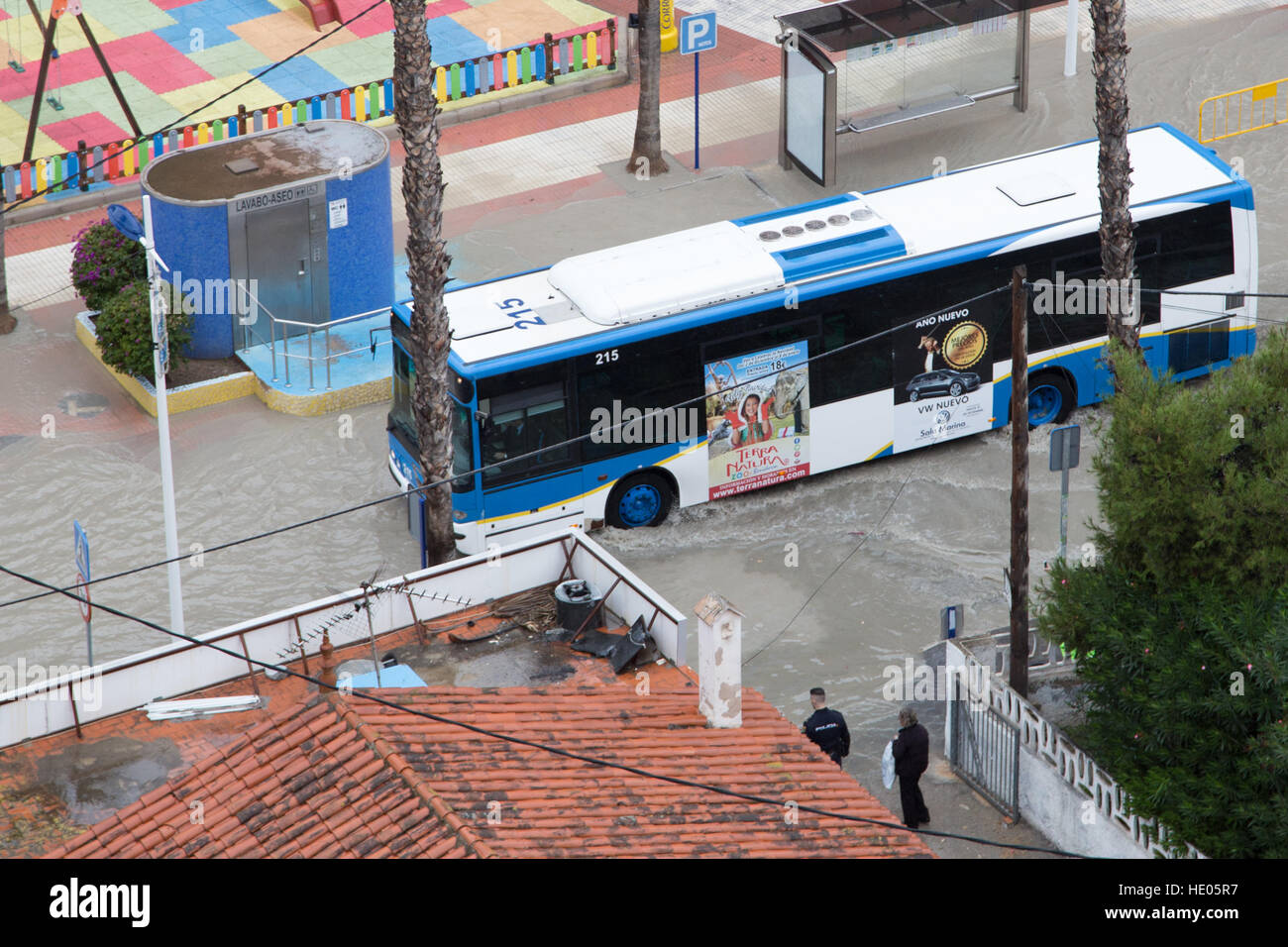 Vehicles drive through floodwater and flooded streets after a flash ...