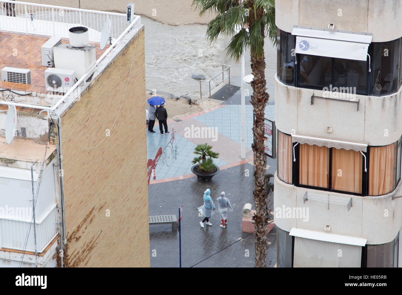 Vehicles drive through floodwater and flooded streets after a flash ...