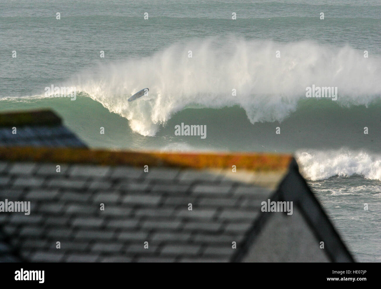 Newquay, UK. 16th December 2016. A surfer loses his surfboard to a ...