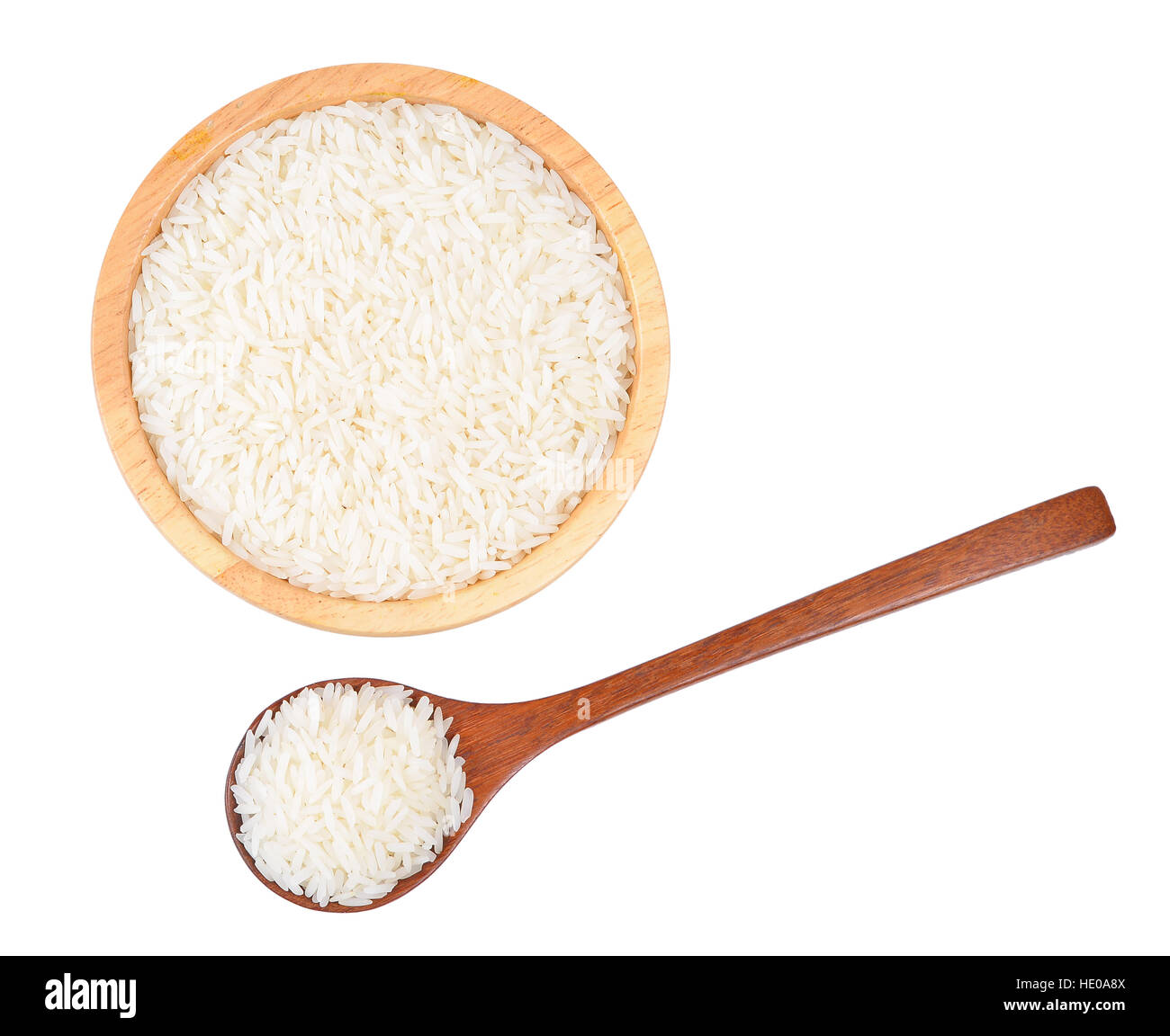 top view of rice in wooden bowl and spoon isolated on white Stock Photo ...