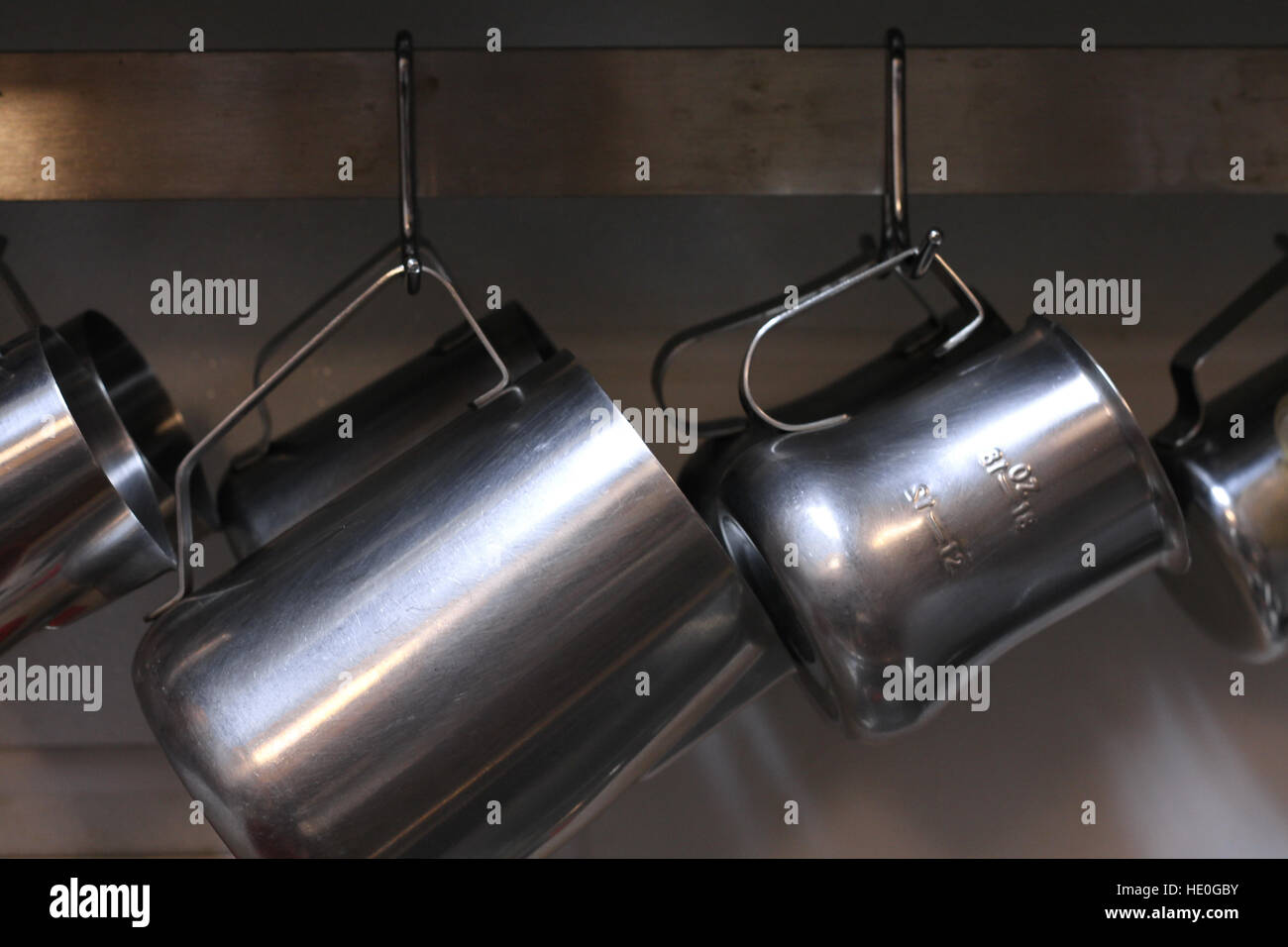 row of hanging pitchers Stock Photo - Alamy