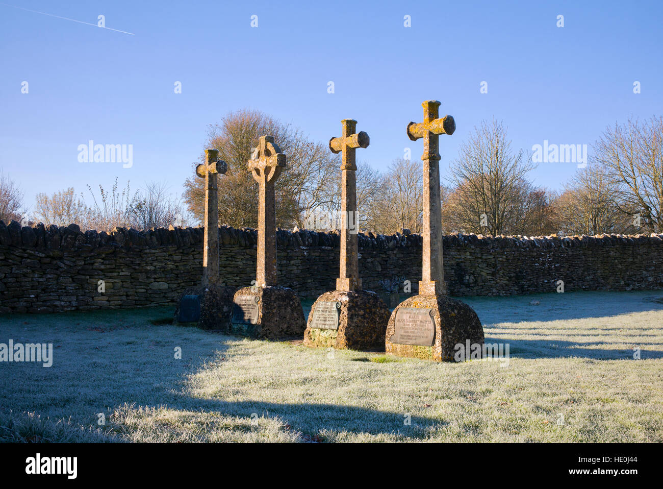 Four gravestone crosses in the winter frost at St Michael church ...