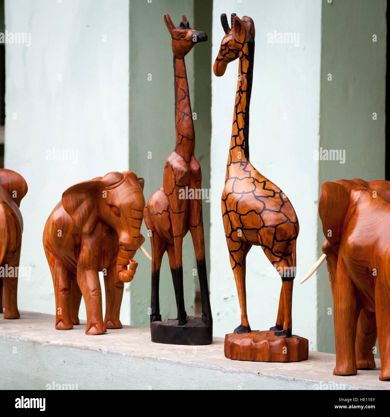 Souvenir animal sculptures in Sierra Leone. Giraffes are only available ...