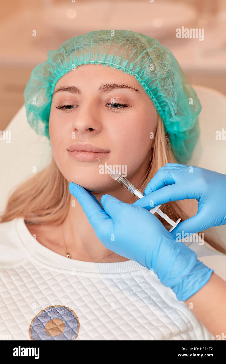 Closeup of beautiful woman gets injection in her lips Stock Photo - Alamy