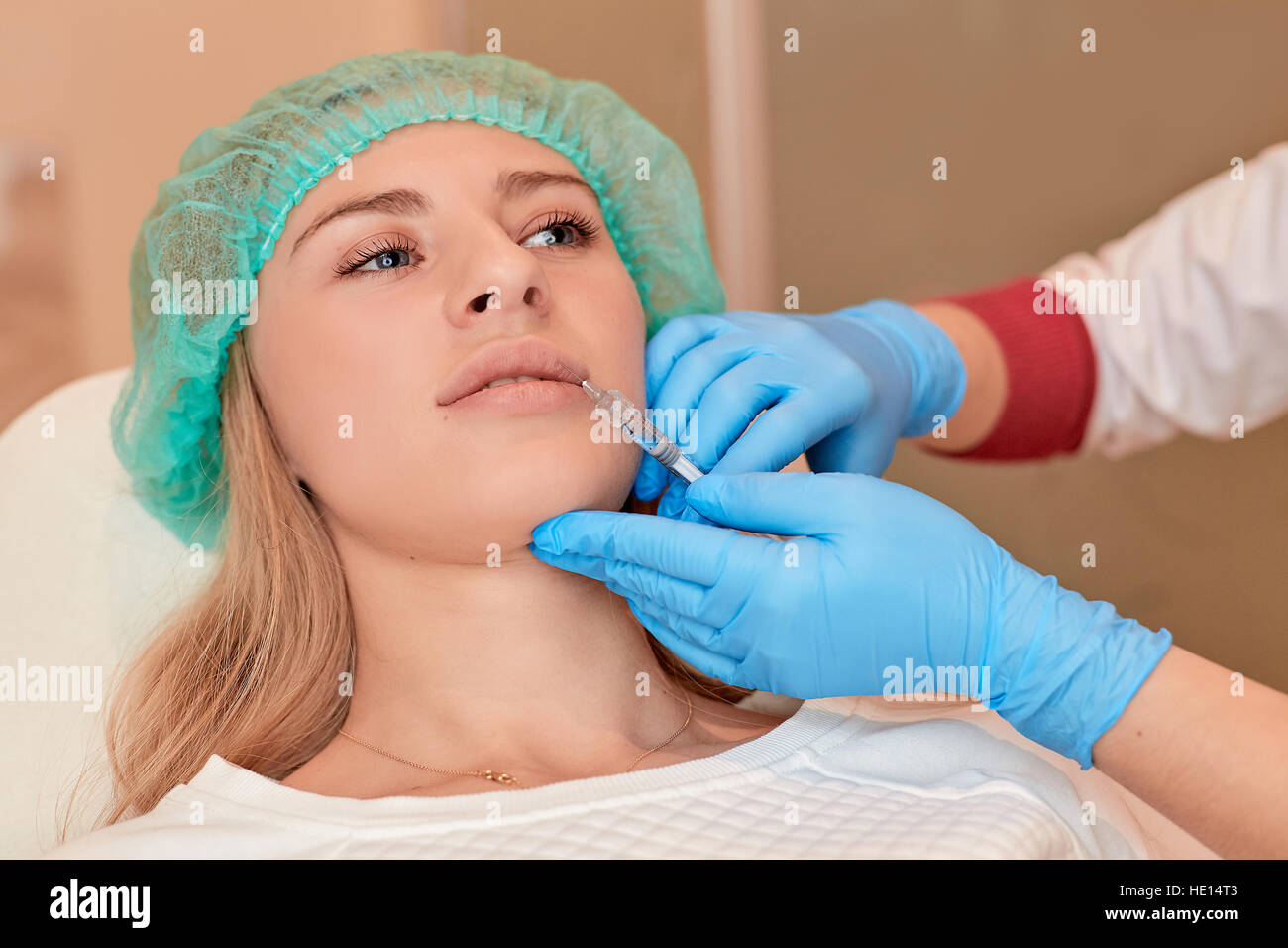 Closeup of beautiful woman gets injection in her lips Stock Photo - Alamy