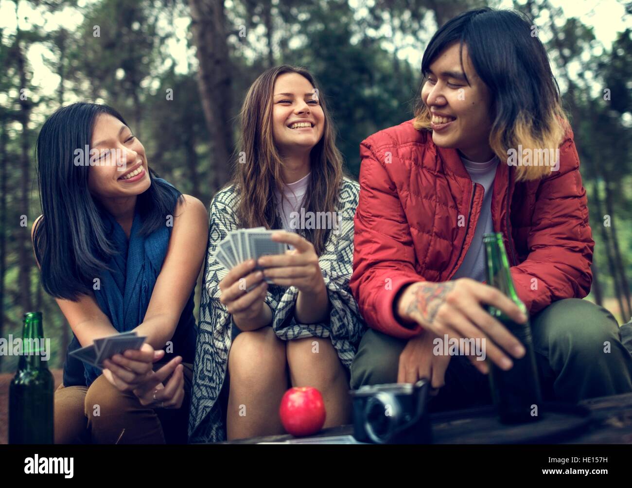 Friends Camping Playing Cards Concept Stock Photo - Alamy