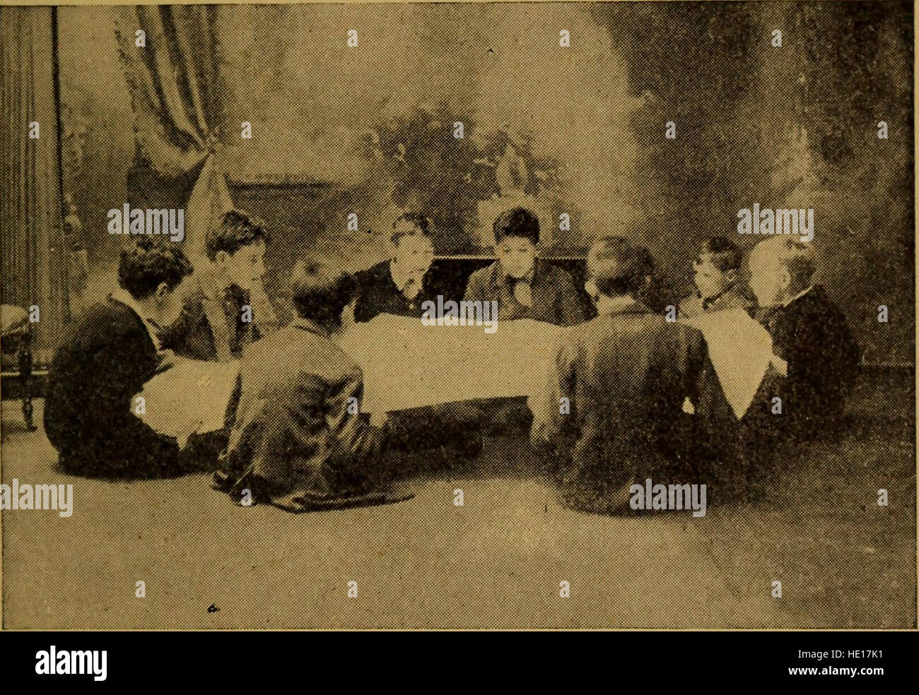 This early 20th-century image shows boys engaged in indoor games and ...