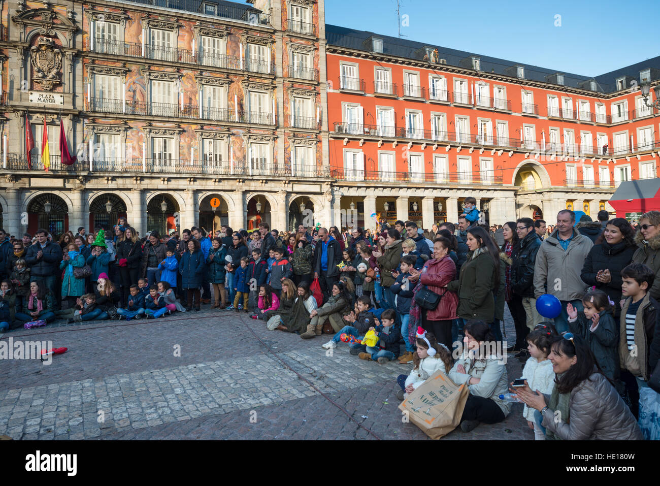 Crowd gather to see a street entertainer at Plaza Mayor, Madrid, Spain ...