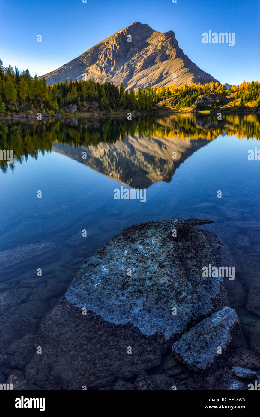 Fossil Mountain rises above Little Baker lake in the Skoki Wilderness ...