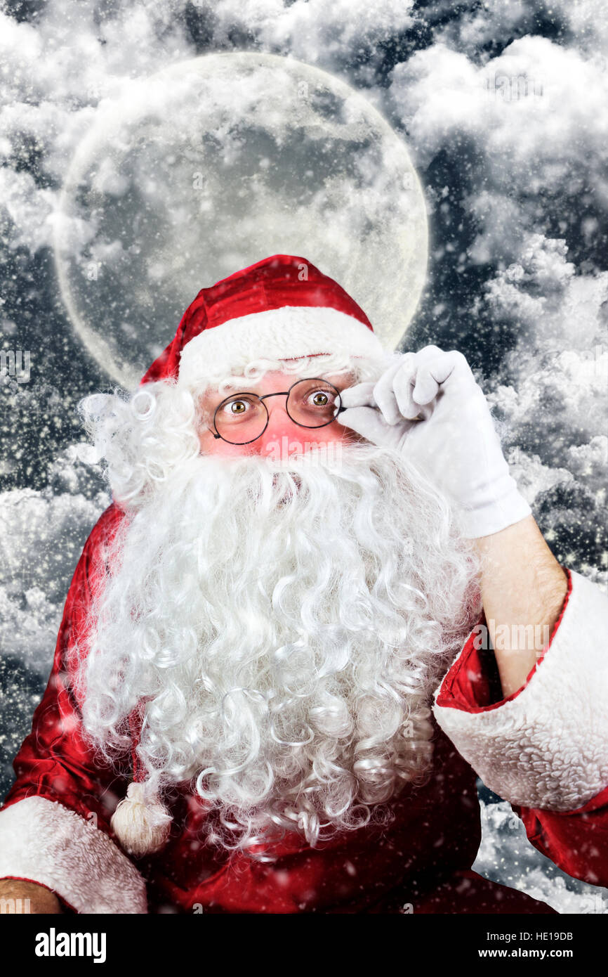 Father christmas in night sky with moon hi-res stock photography and ...