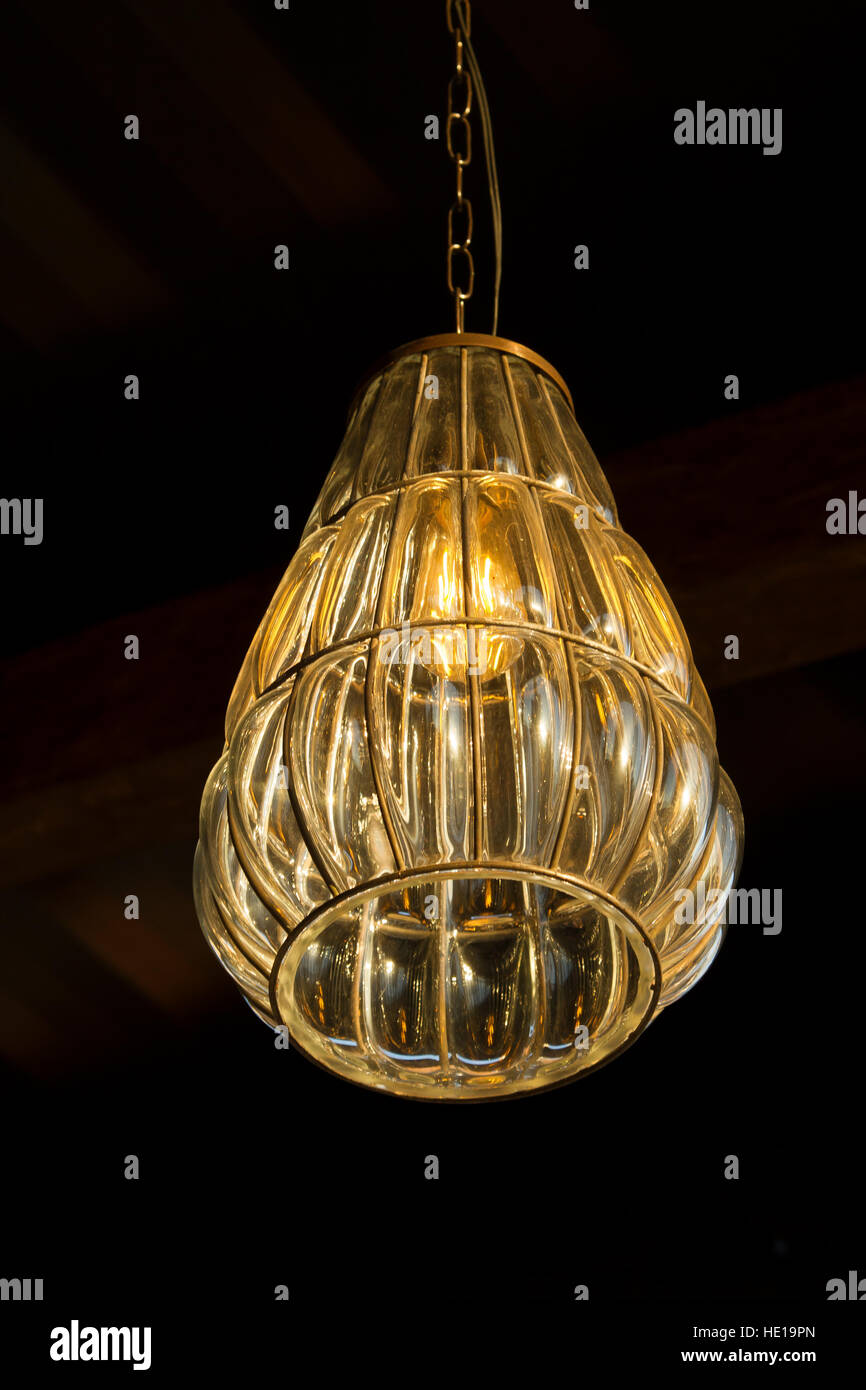 Single beautiful lamp hanged to the ceiling by chain Stock Photo - Alamy