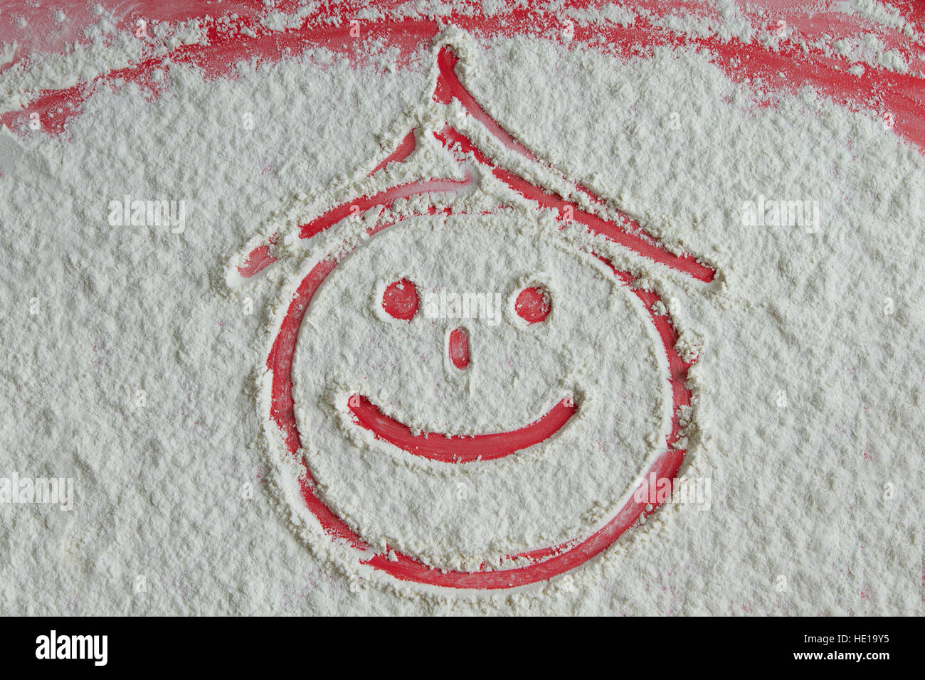Smile face pictured on the flour background Stock Photo - Alamy