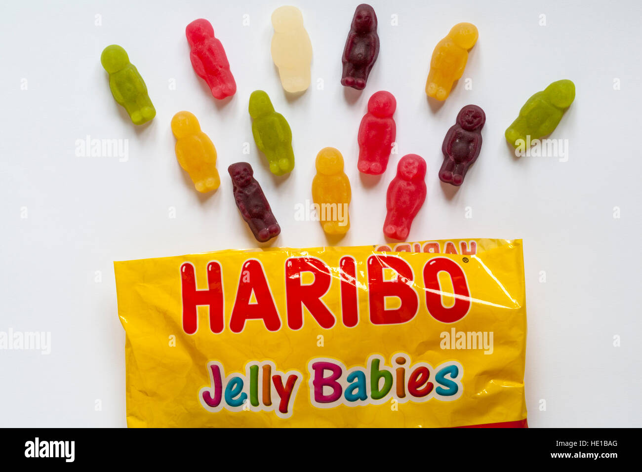 packet of Haribo Jelly Babies opened with contents spilled on white ...