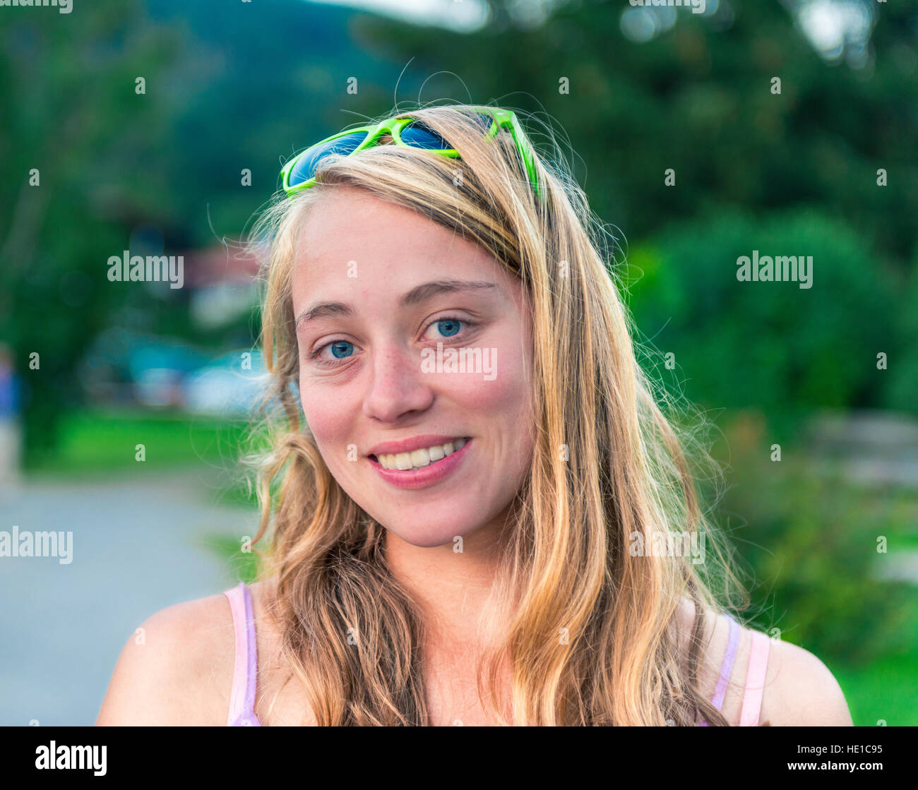 Young woman with sunglasses on head, smiling, Schliersee, Upper Bavaria ...