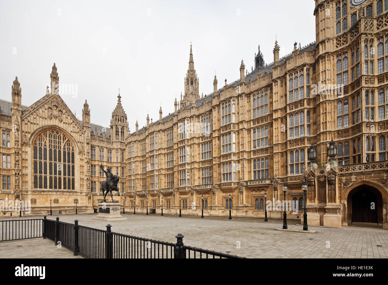 The Palace of Westminster (Houses of Parliament) facade with King Richard I statue in front ...