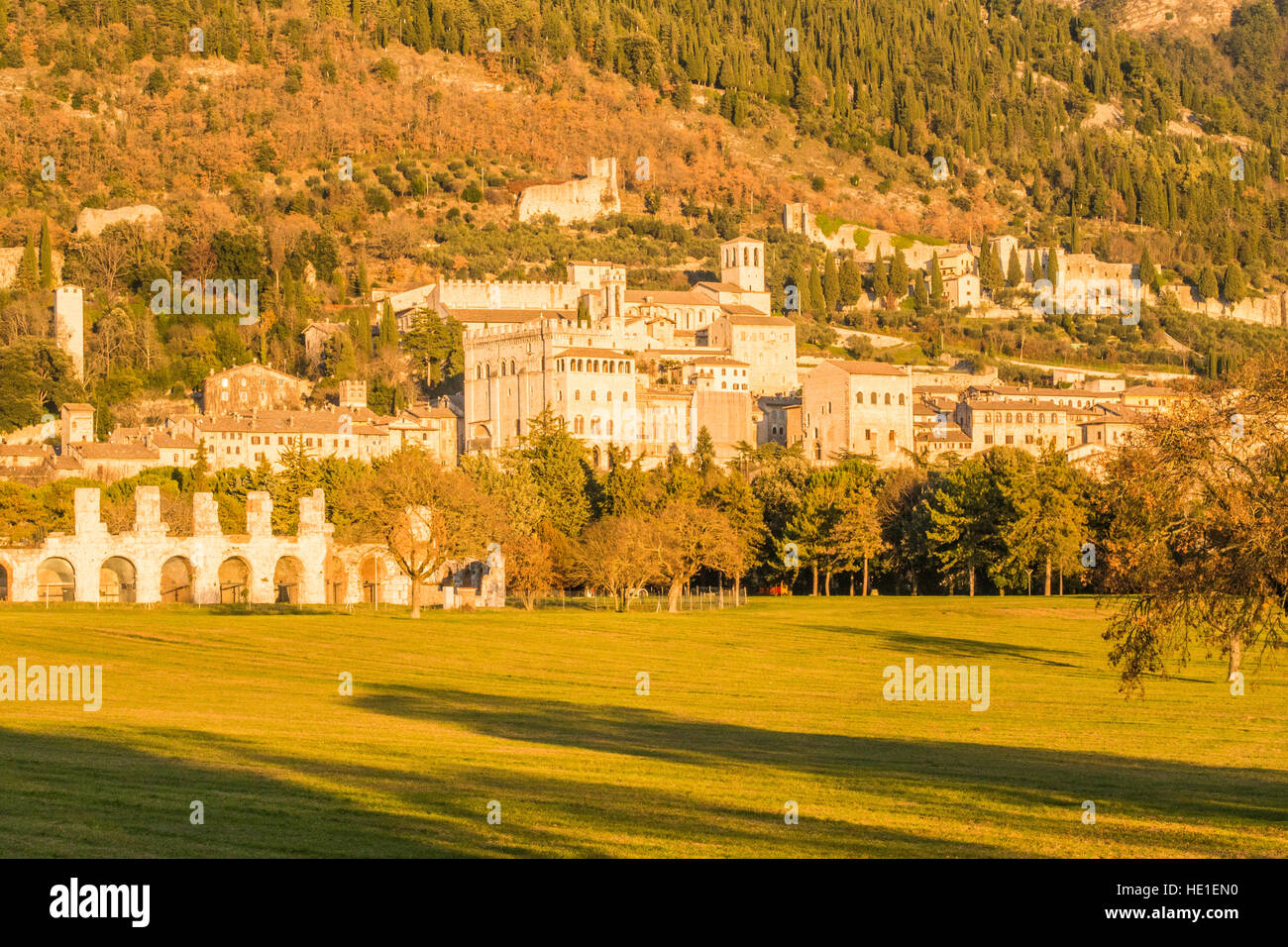 Roman Theatre ruins in Gubbio with the medieval town centre behind on ...