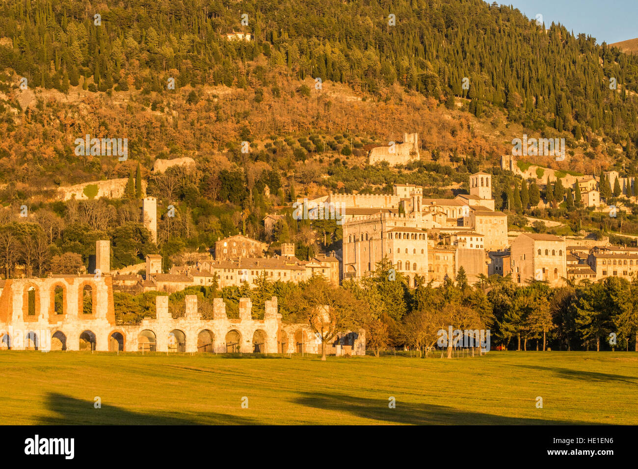 Roman Theatre ruins in Gubbio with the medieval town centre behind on ...