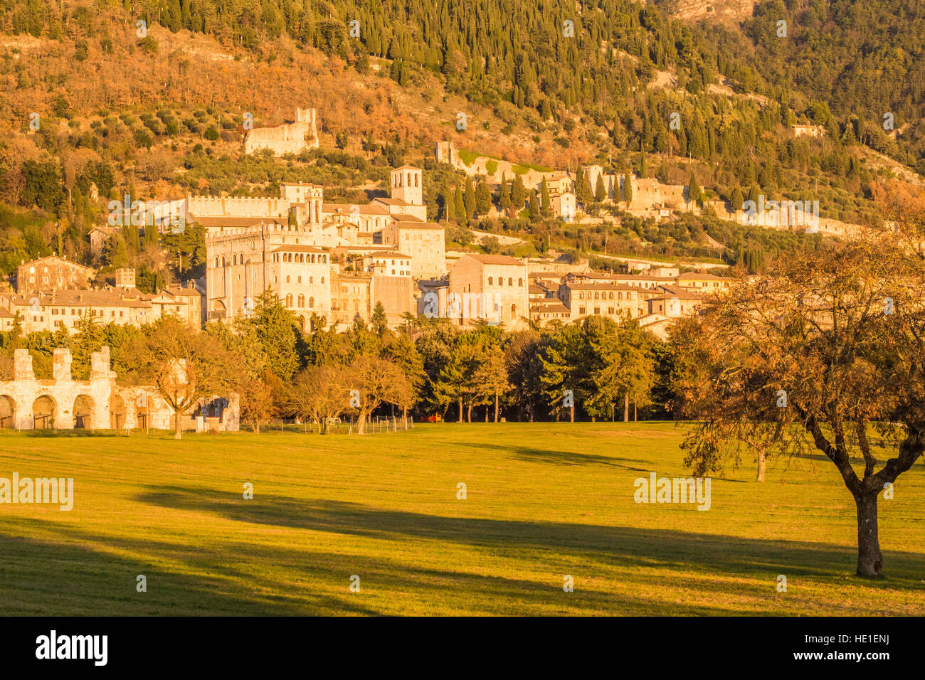 Roman Theatre ruins in Gubbio with the medieval town centre behind on ...