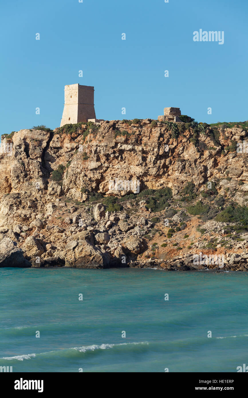 Maltese rocky seascape and Ghajn Tuffieha Tower, Riviera Bay, Malta ...