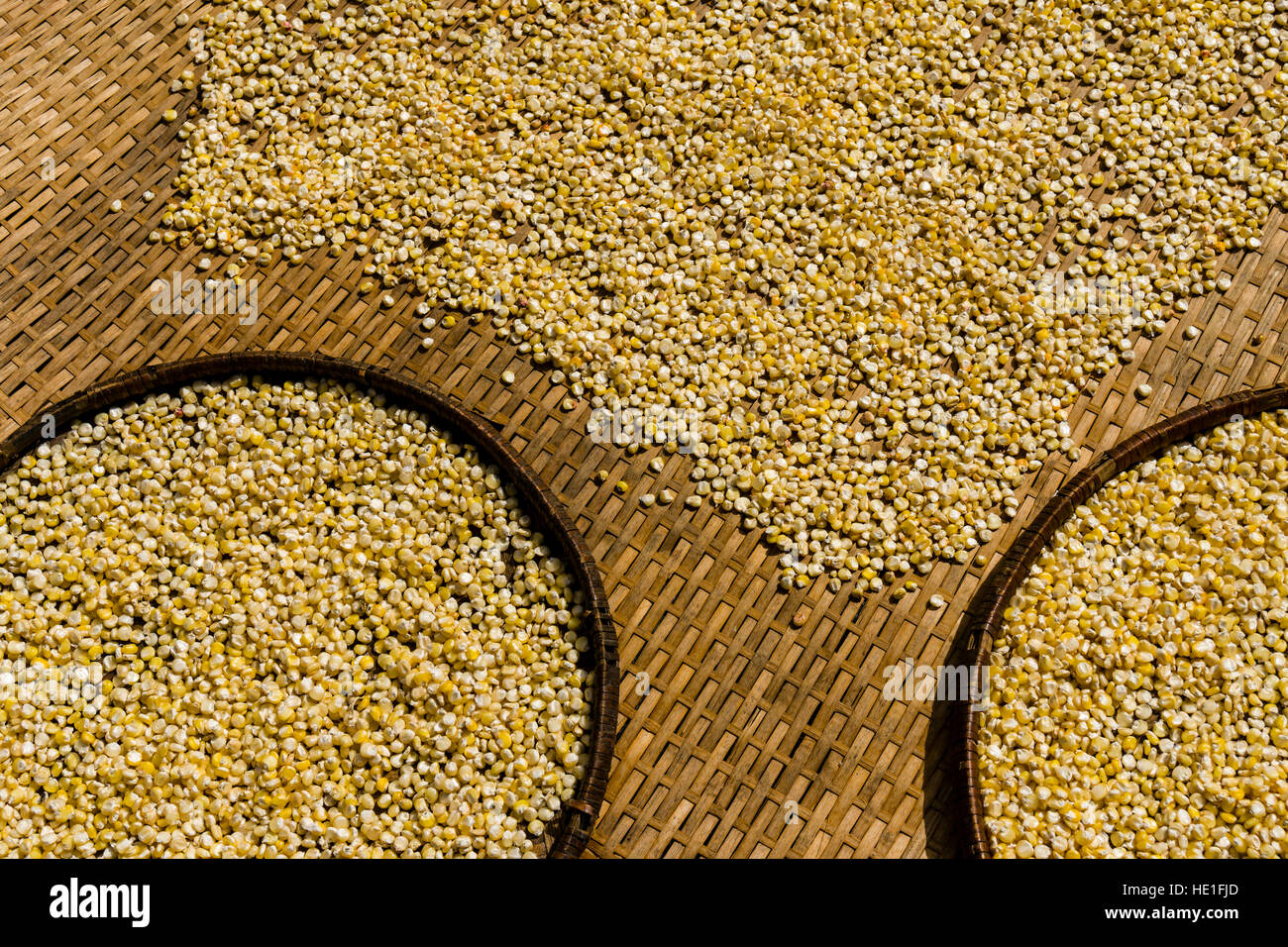 Corn is drying in the sun on a braided mat Stock Photo - Alamy