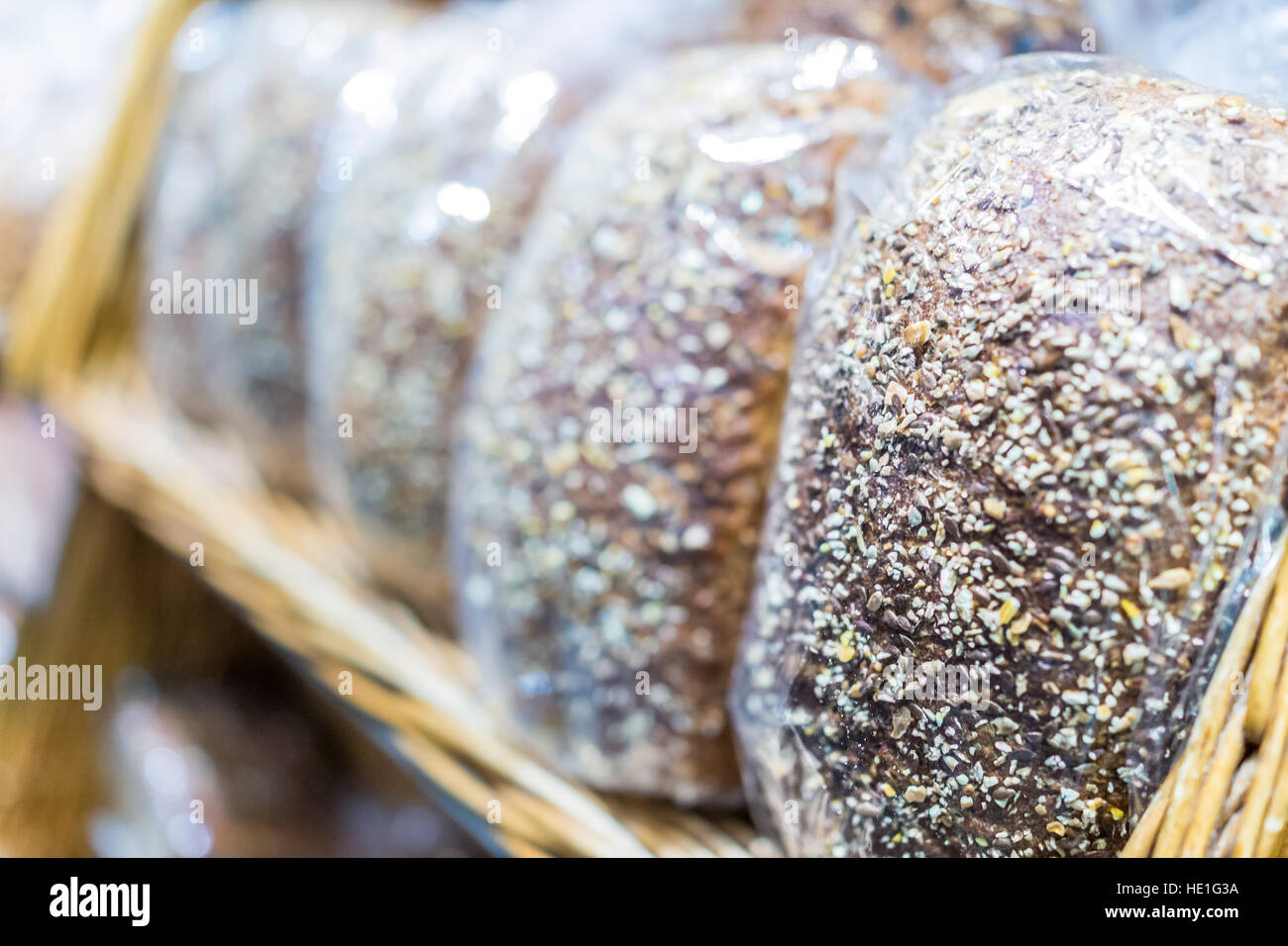 Packaged multi grain bread on display in bakery Stock Photo - Alamy