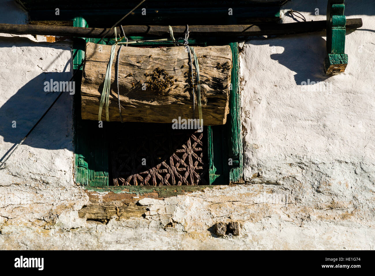 A beehive is placed in a wooden trunk at a farmhouse in the historical ...