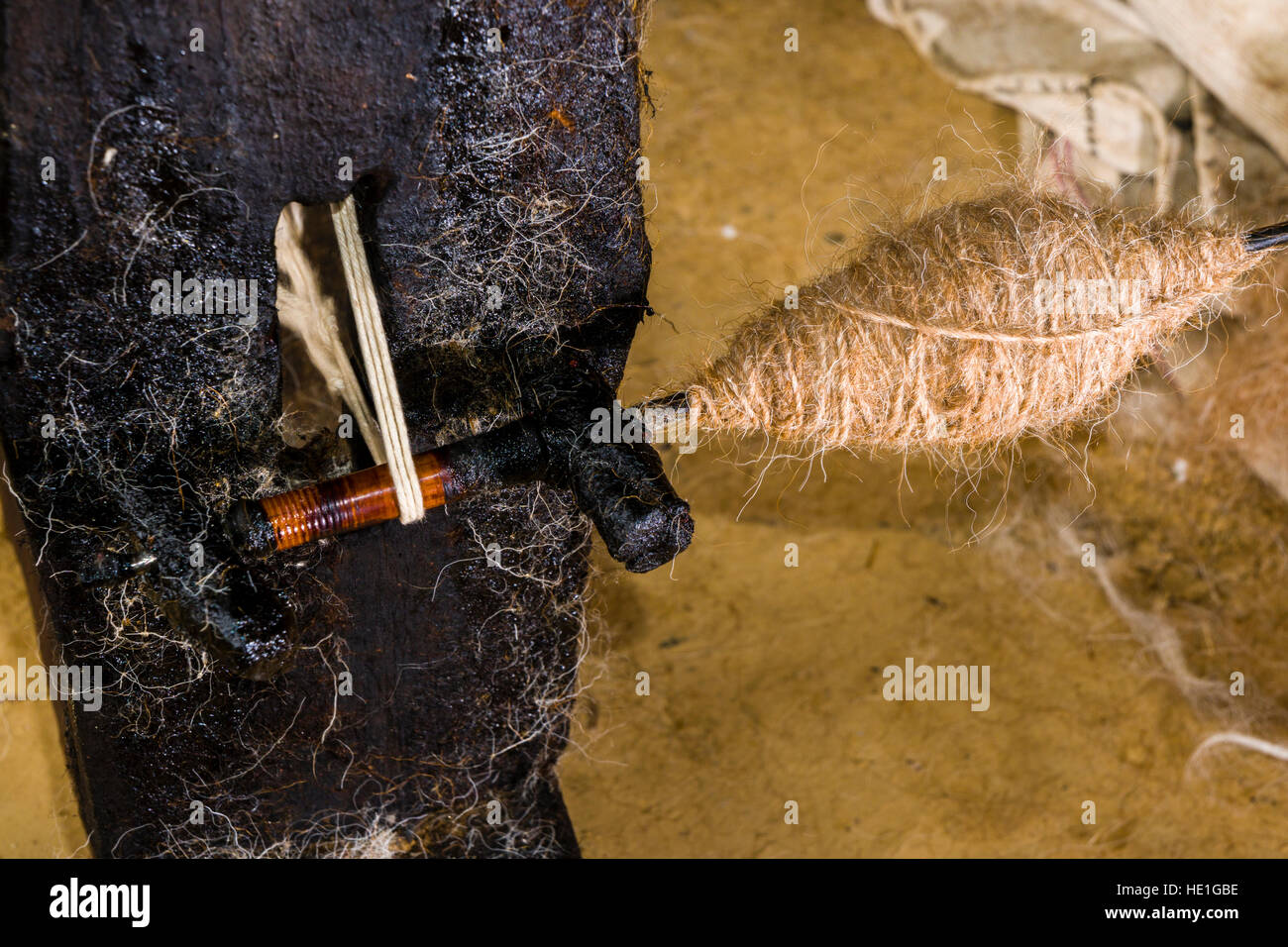 A spindle of spun sheep wool at a traditional spinning wheel Stock ...