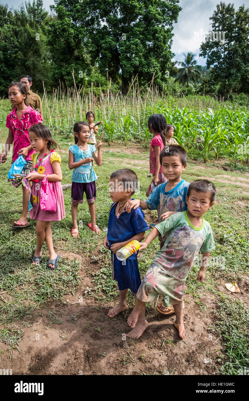 River scenery on the Mekong River Young children at a village on the ...