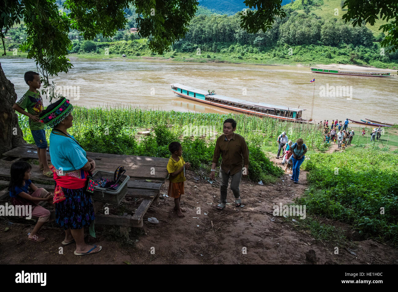 River scenery on the Mekong River Young children at a village on the ...