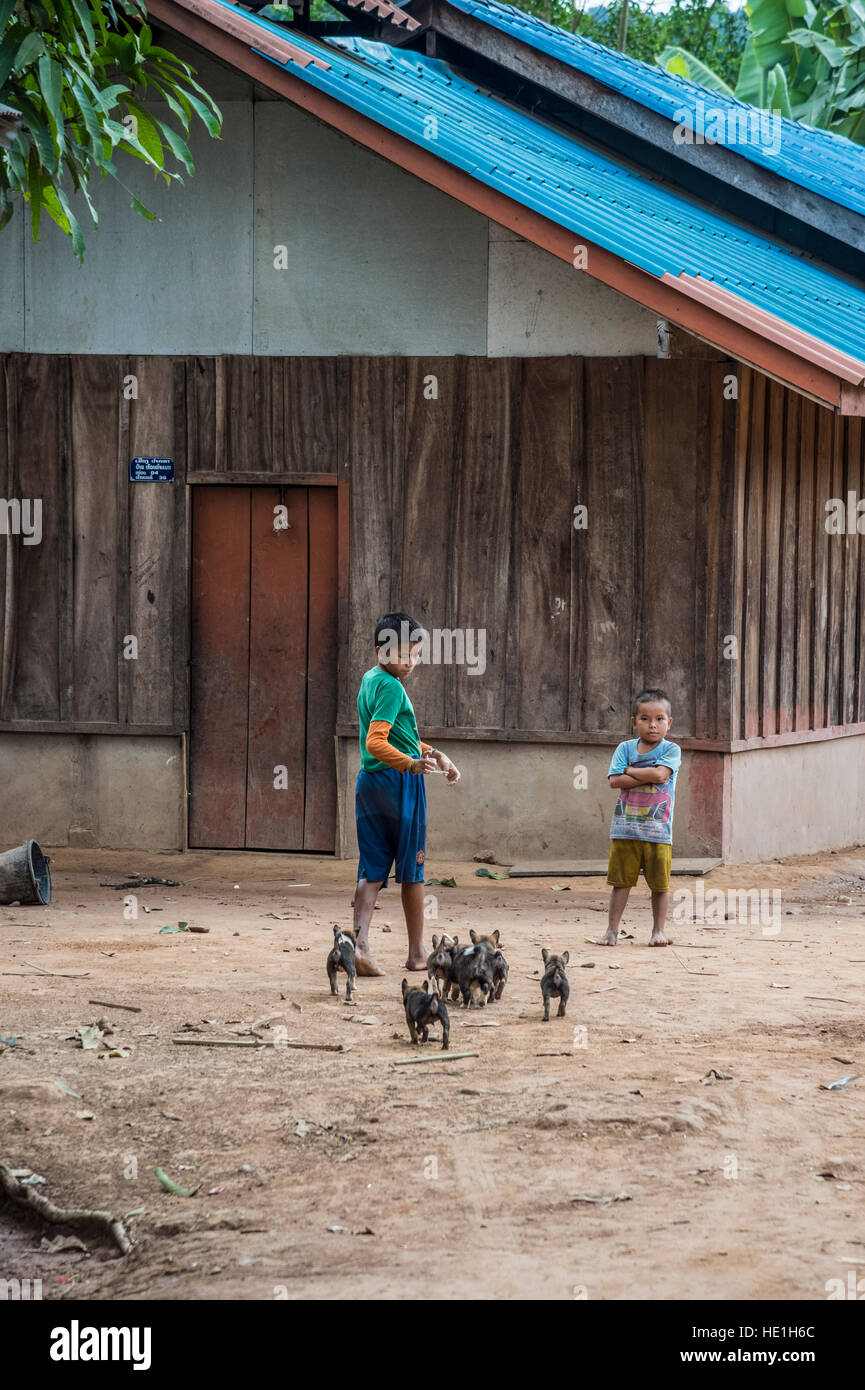 River scenery on the Mekong River Young children at a village on the ...
