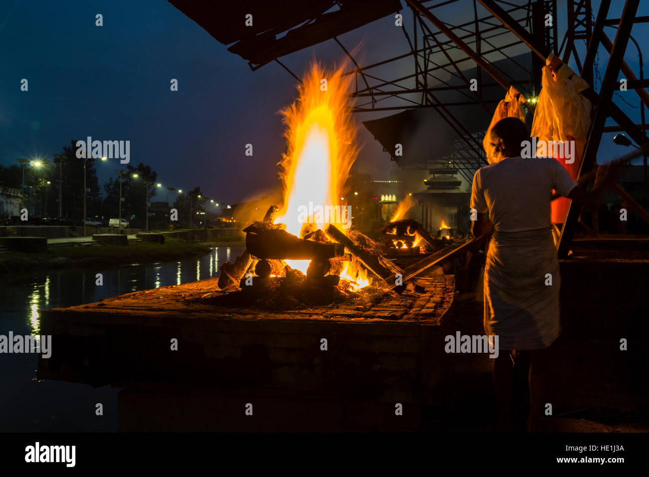 Cremation of a dead body at the burning ghats of Pashupatinath temple ...