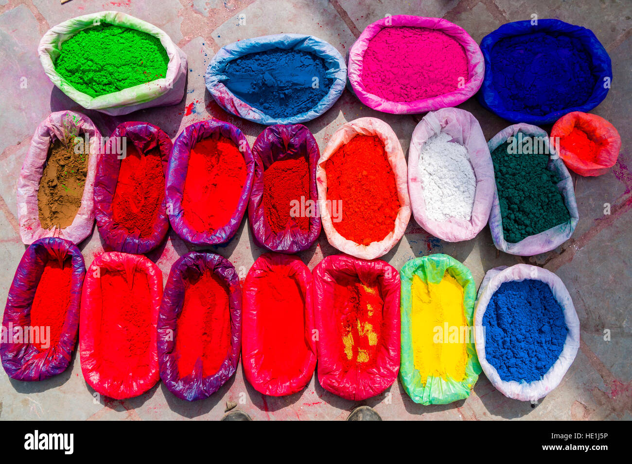 Color powder of different colors in plastic bags for religious use is ...