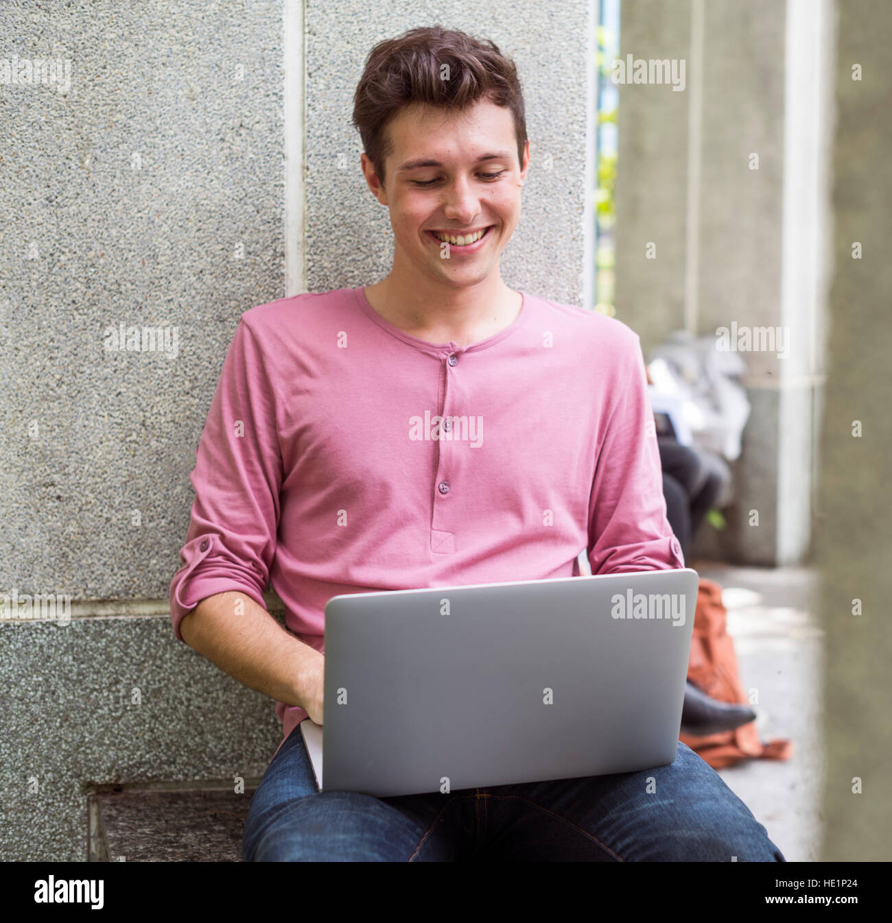 Young Guy Browsing Laptop Campus Concept Stock Photo - Alamy