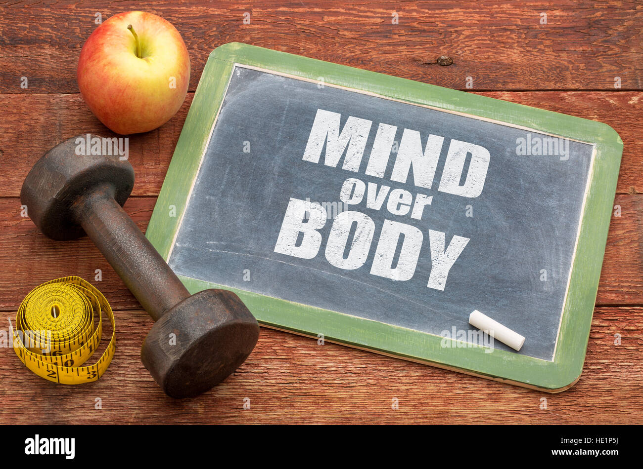 mind over body concept - slate blackboard sign against weathered red ...