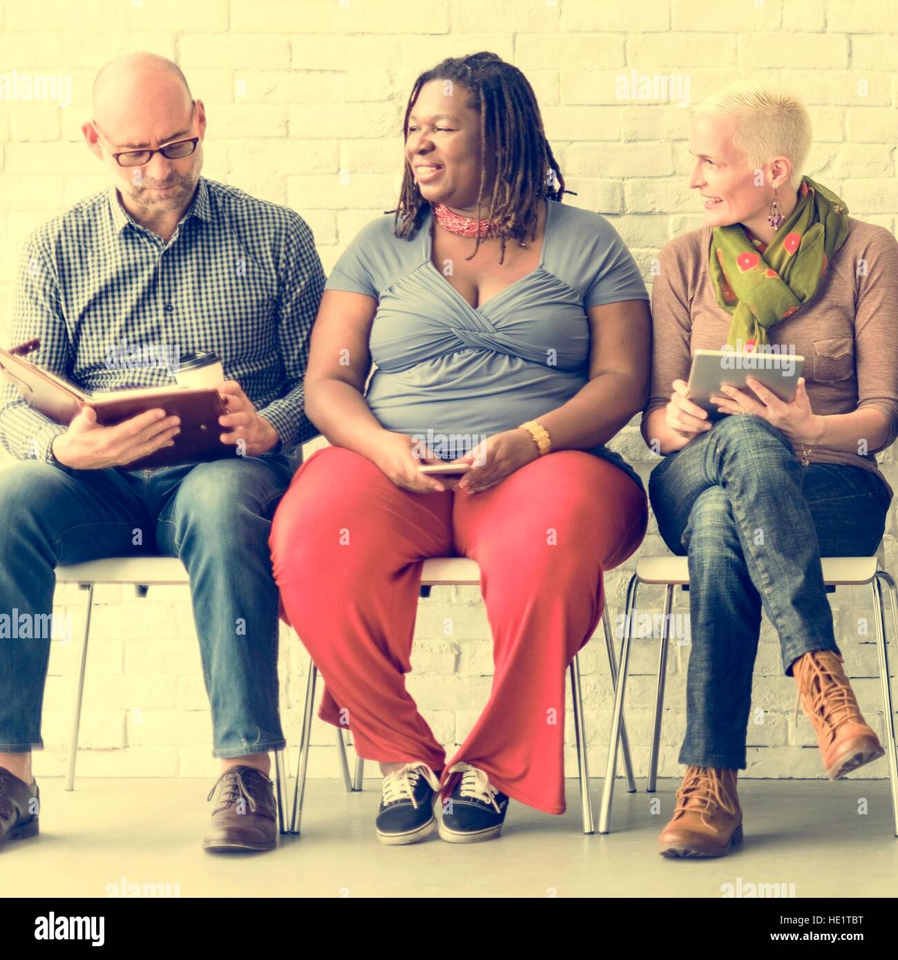 Diverse Group of People Community Togetherness Technology Sitting ...