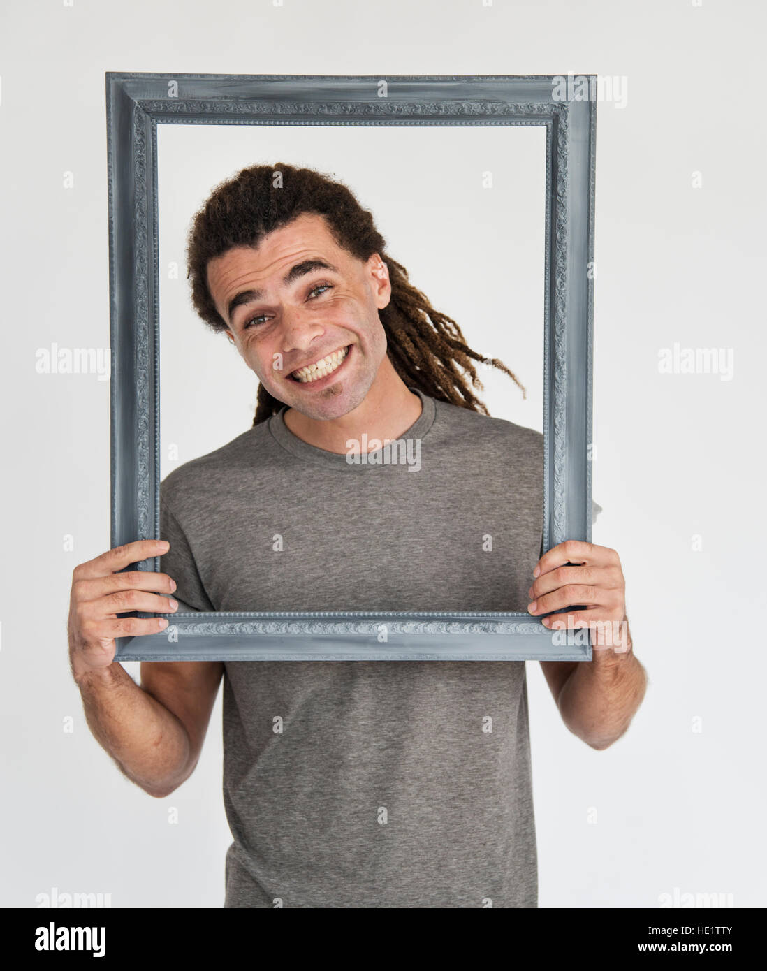 Hipster Man Smiling Holding Frame Concept Stock Photo - Alamy