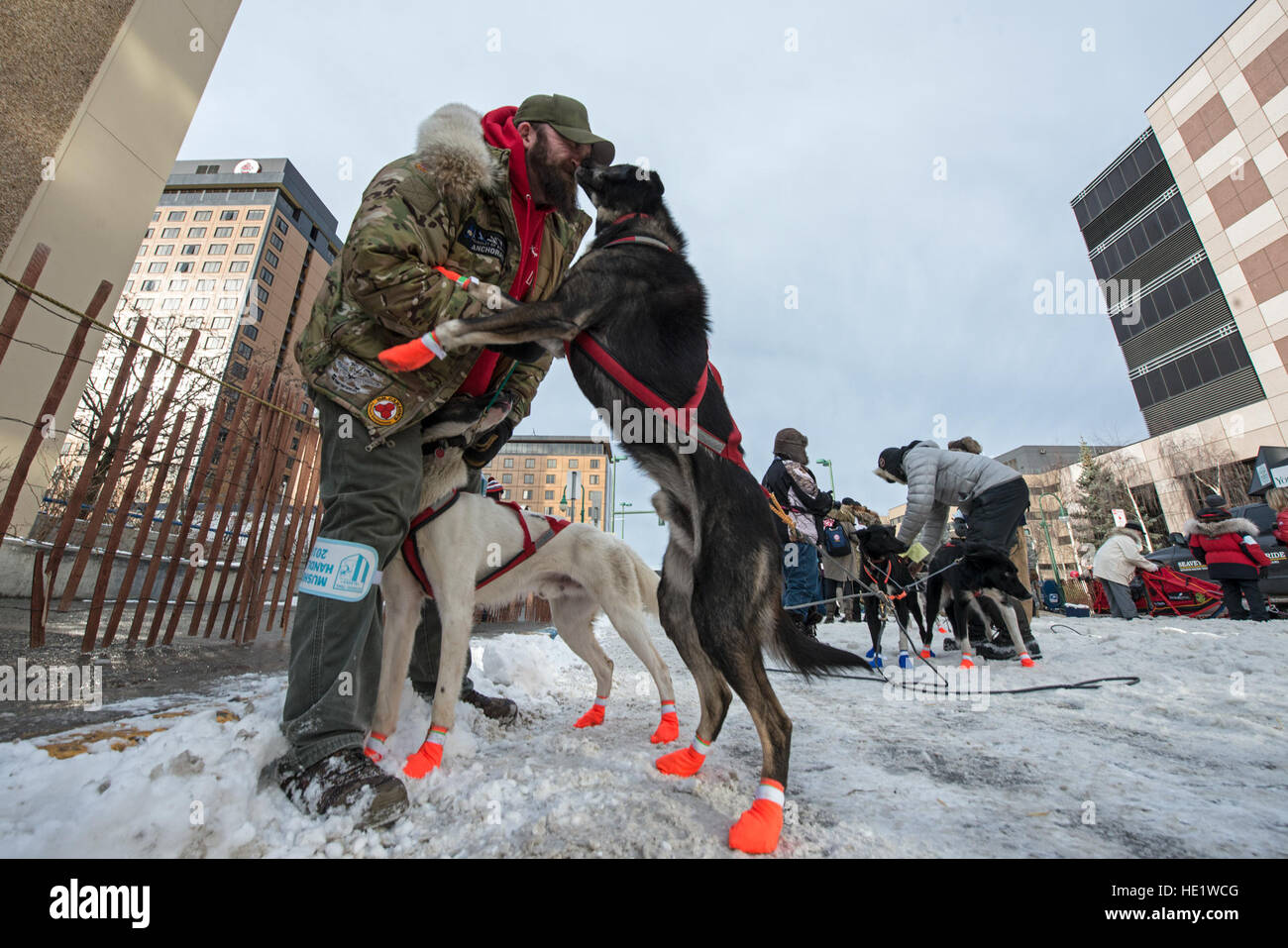 Matt Berth gives a kiss to a Battle Dawgs' sled dog before the ...