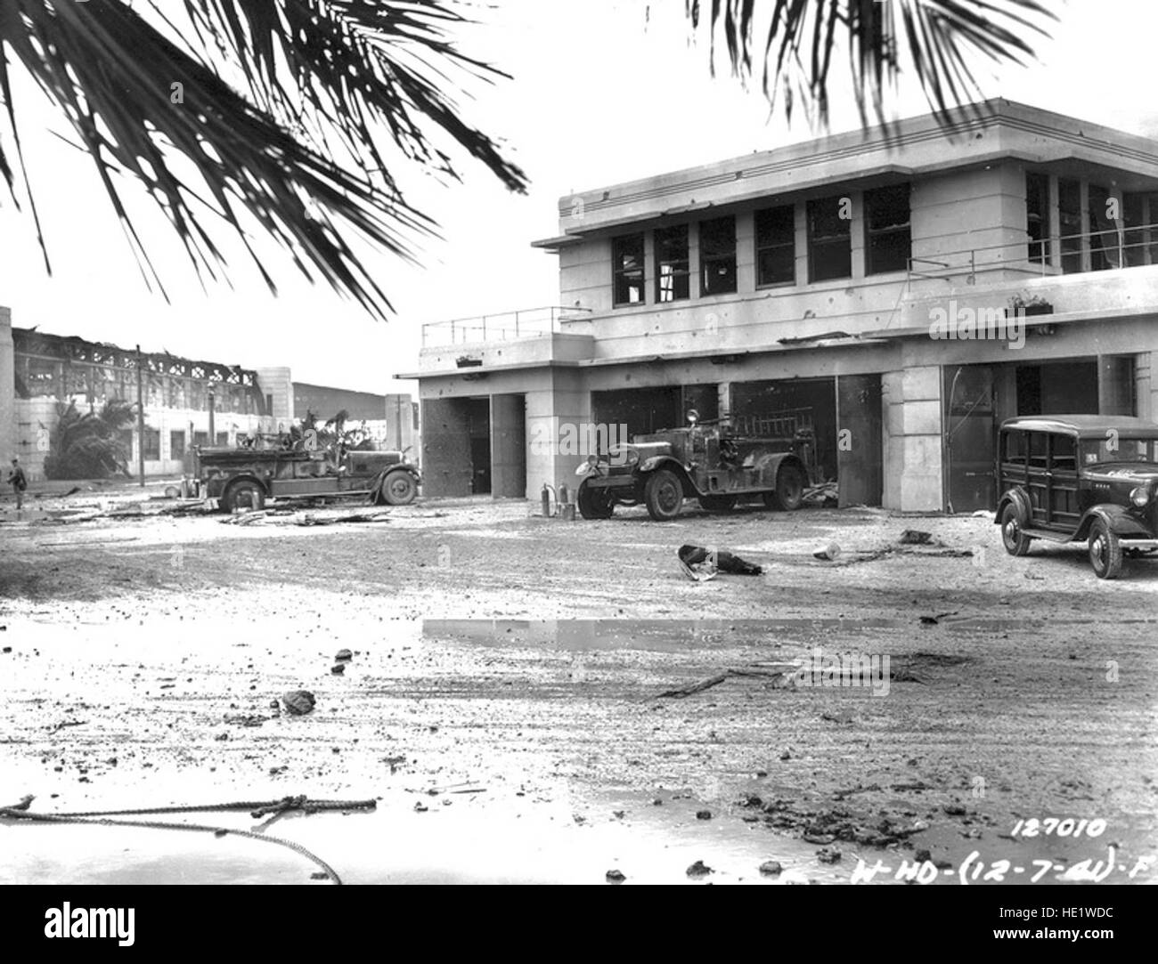 Strafed Fire House on Hickam Air Field with two fire trucks outside and ...
