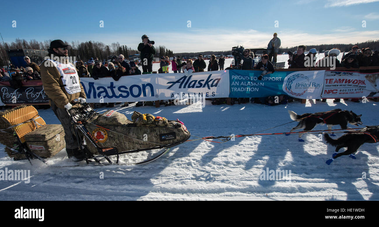 The Battle Dawgs sled dog team races down the trail during the official ...