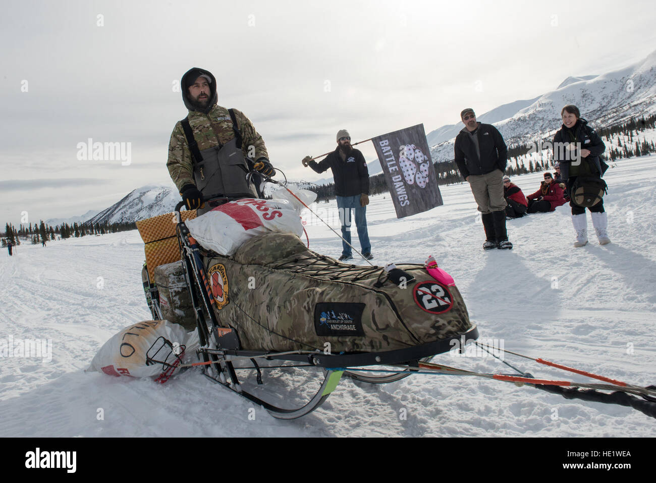 Hunter L. holds the Battle Dawgs sign as Musher Rick Casillo and the ...