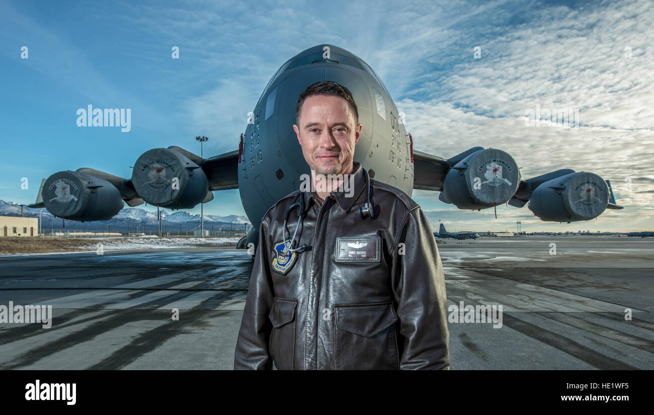 Maj. Chris Backus, a pilot-physician, stands in front of his airframe ...