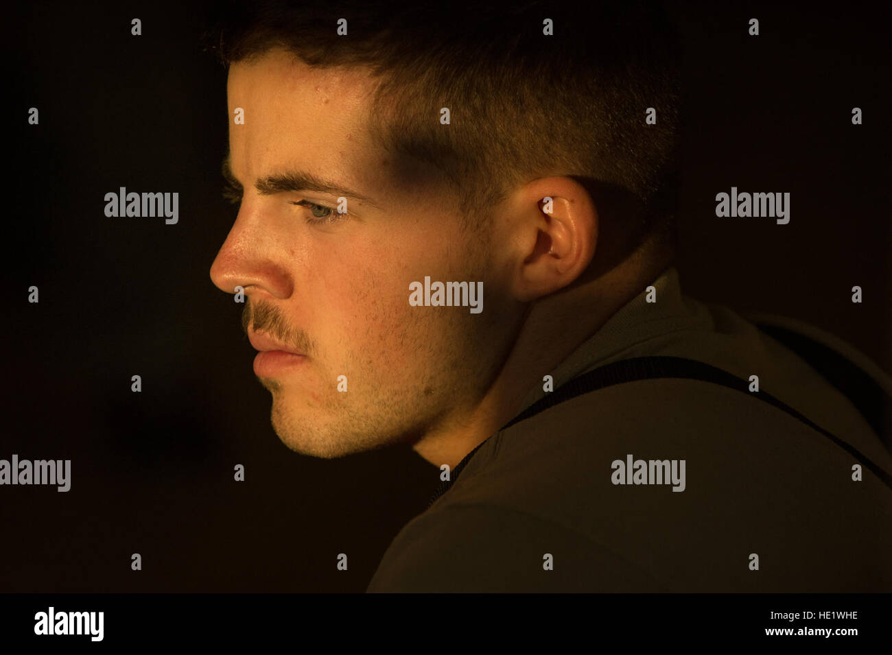 The sunlight peers through the window onto Senior Airman Mark Kepler ...