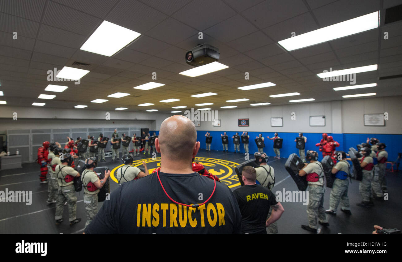 Security Forces patrolmen rotate inside of a warrior circle attempting ...