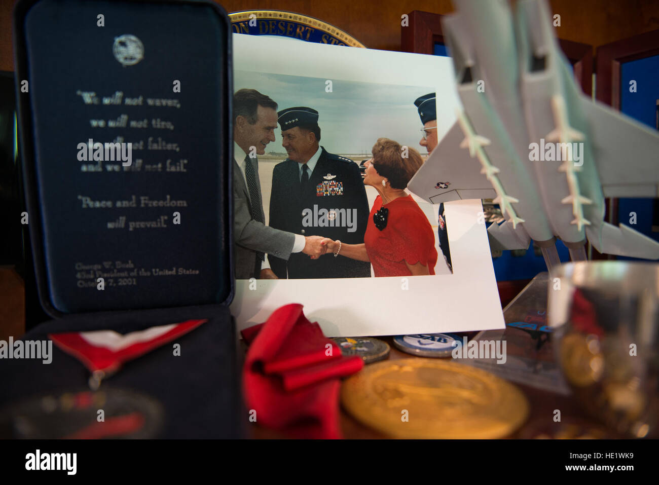 A photograph of President George H.W. Bush greeting Air Force Gen ...