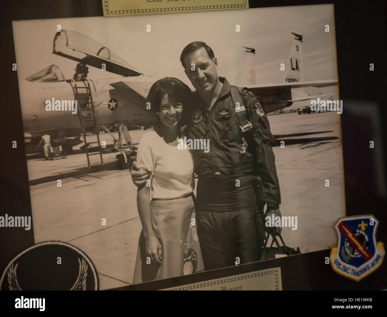 A framed photo on a bookshelf, of then Colonel, and now retired Gen ...