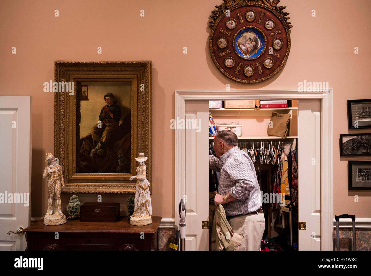 Retired Air Force Gen. Charles Horner goes through his closet to pull ...