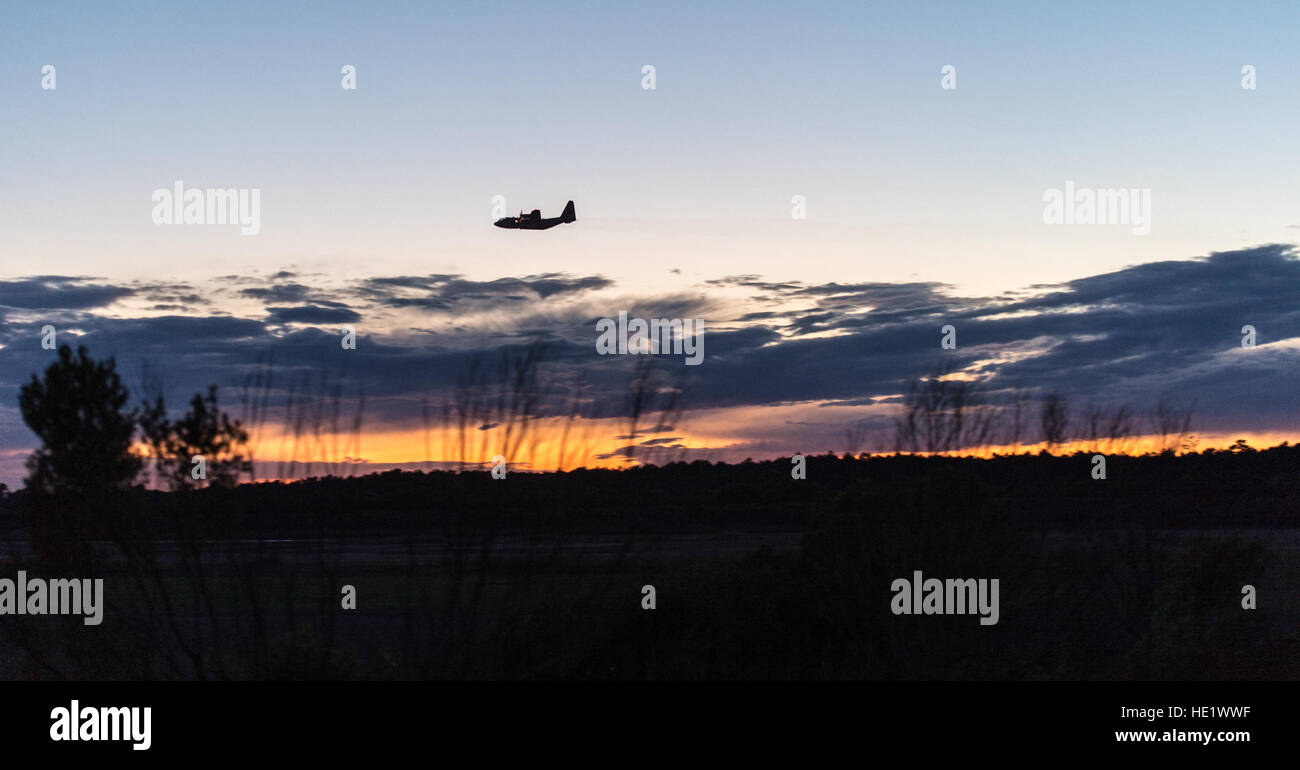 A C-130 Hercules flies an aerial spray mission at an altitude of 350 ...