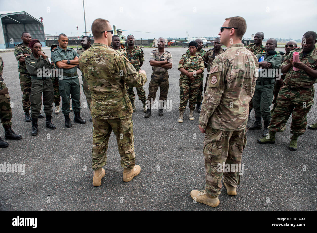 Capt. Phil Caraghiaur translates English to French for Maj. Sills ...